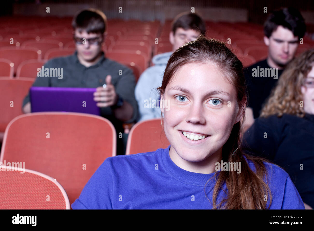 Friends watching movie in theater Stock Photo - Alamy