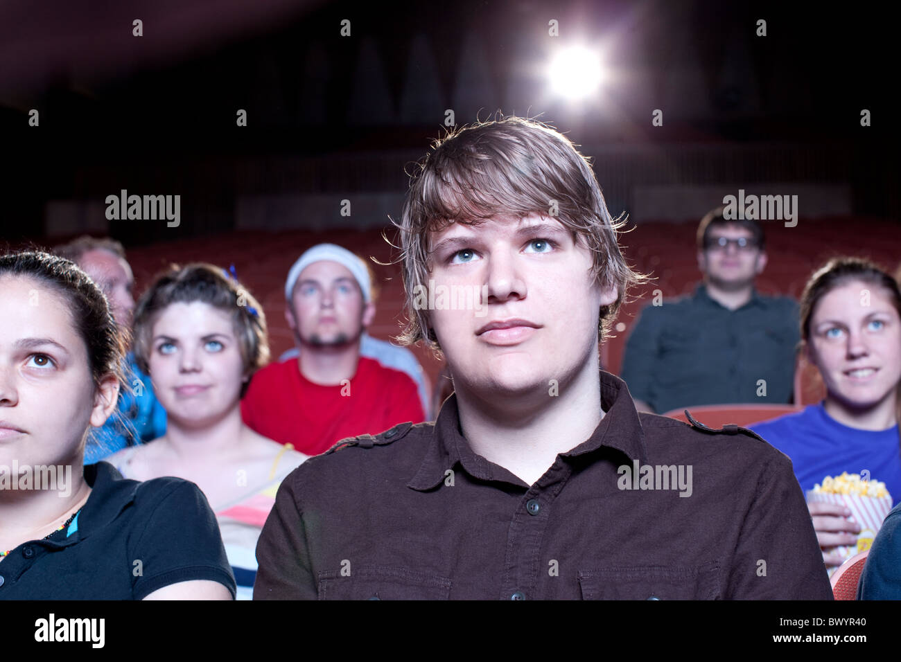 Friends watching movie in theater Stock Photo - Alamy