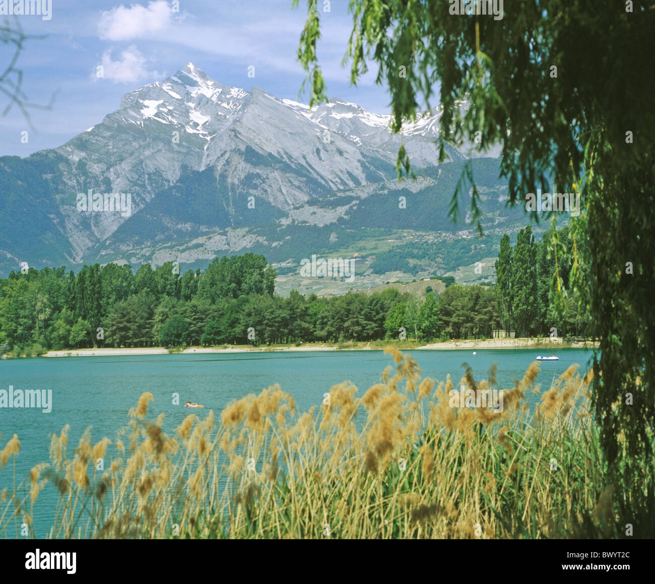 alpine Alps excavator lake near Sion mountains canton Valais scenery ...