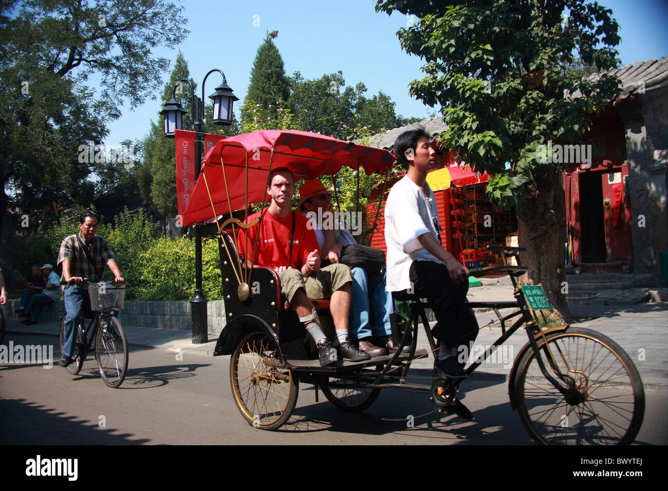 Rickshaw drivers take tourists for Hutong tour, Beijing, China Stock ...