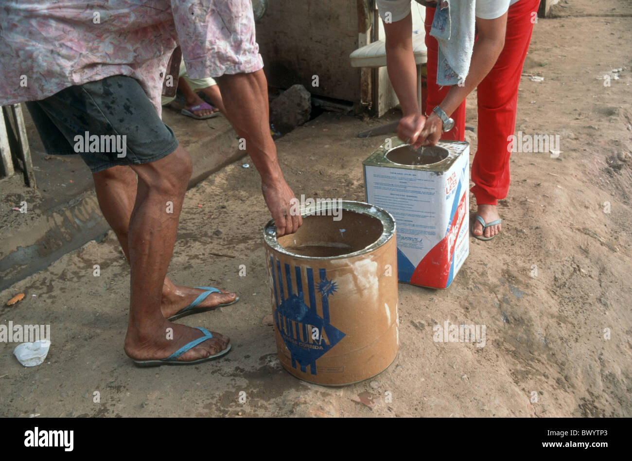 BRAZIL. PEOPLE FETCHING WATER FROM COMMUNAL TAP IN FAVELA SHANTY TOWN ...