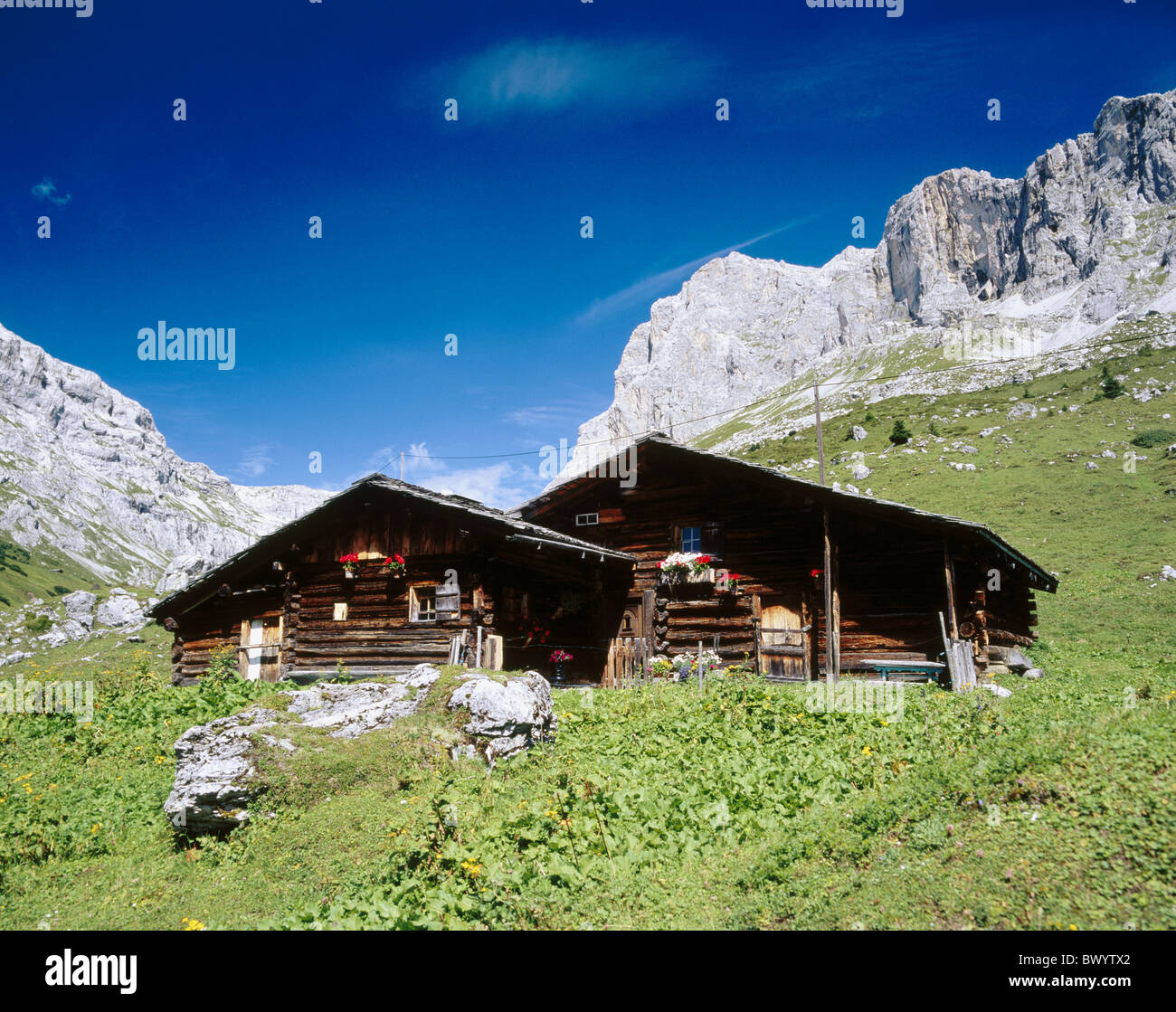 alpine Alps alp huts mountains chalet rock cliff hut canton Graubunden ...