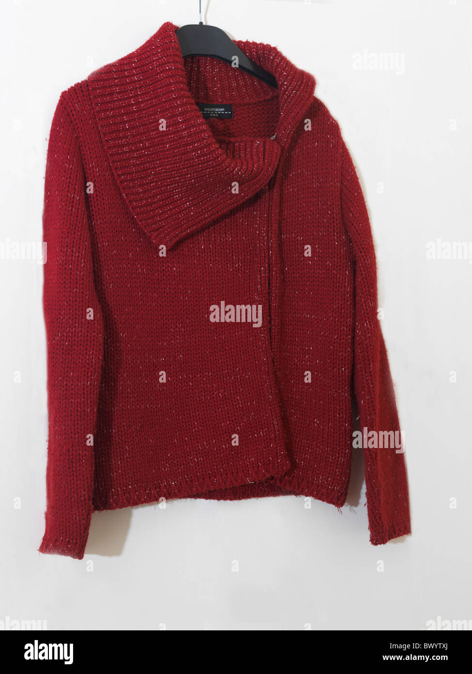 Red jumper On Hanger Stock Photo - Alamy