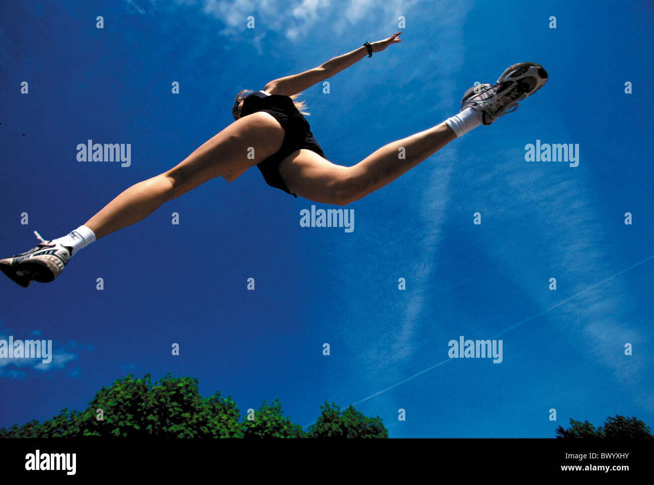 action jump legs running sports spread overview woman Stock Photo - Alamy
