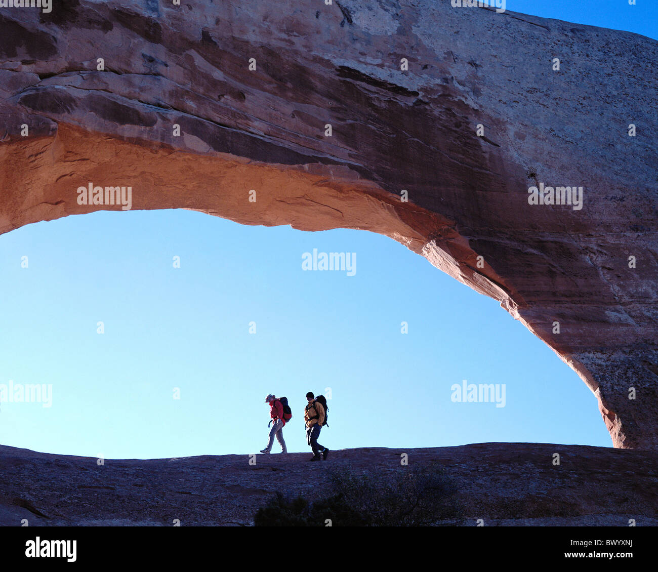 walking hiking Hiking Arches national park cliff arch trekking USA ...