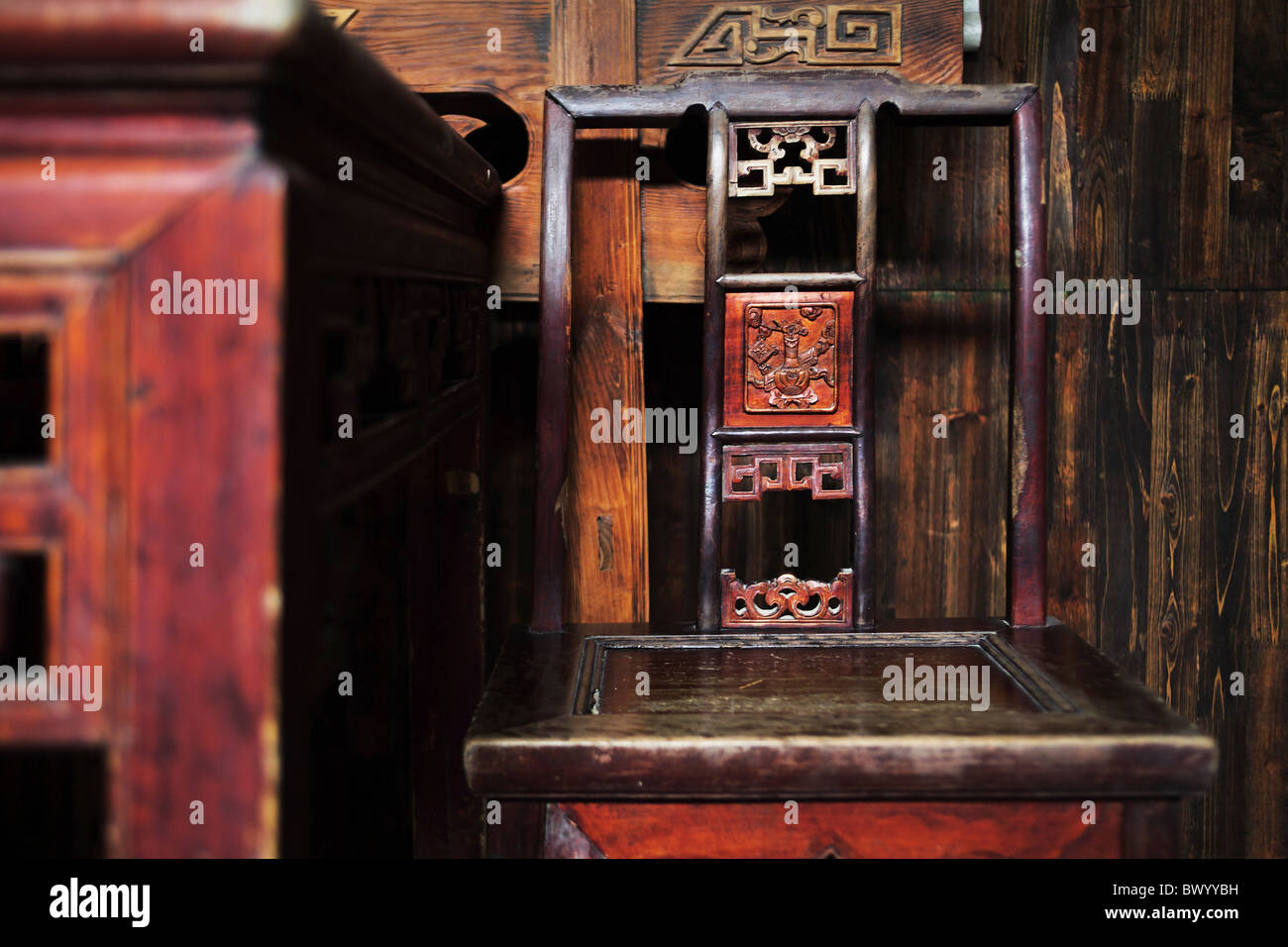 Traditional carved wooden chairs in a Hui style home, Xinghua Village ...