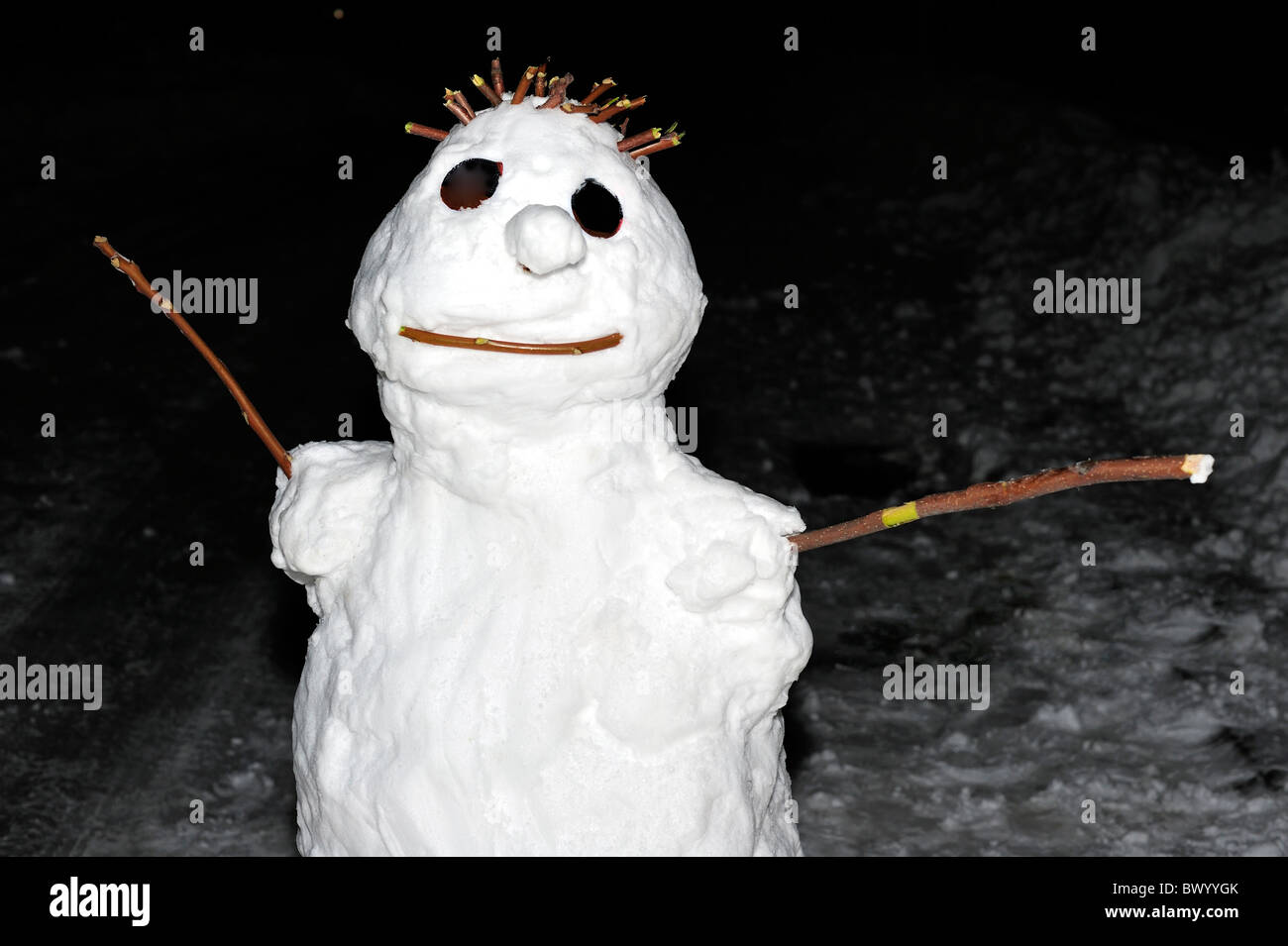 A snowman, photographed at night. Space for text in the night sky Stock ...