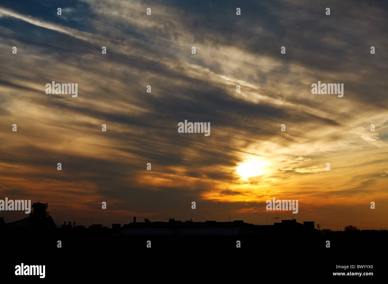 scarlet sunset above town Stock Photo - Alamy
