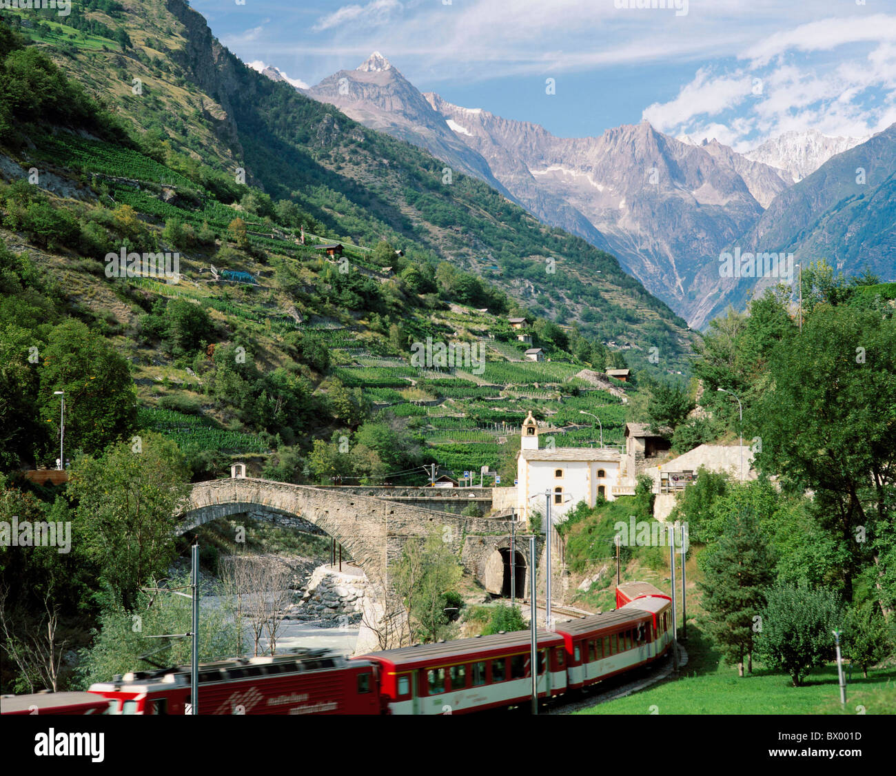 alpine Alps railway mountains bridge village railroad river flow canton ...