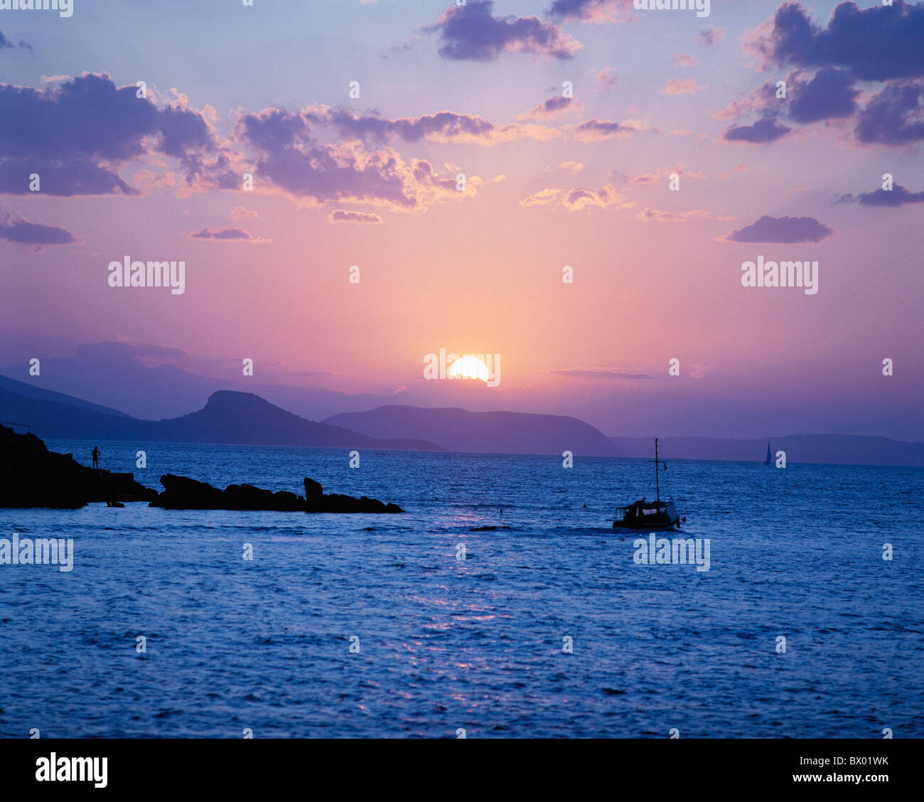 boat dusk twilight cliff coast fish cutter Greece sky island isle hydra ...