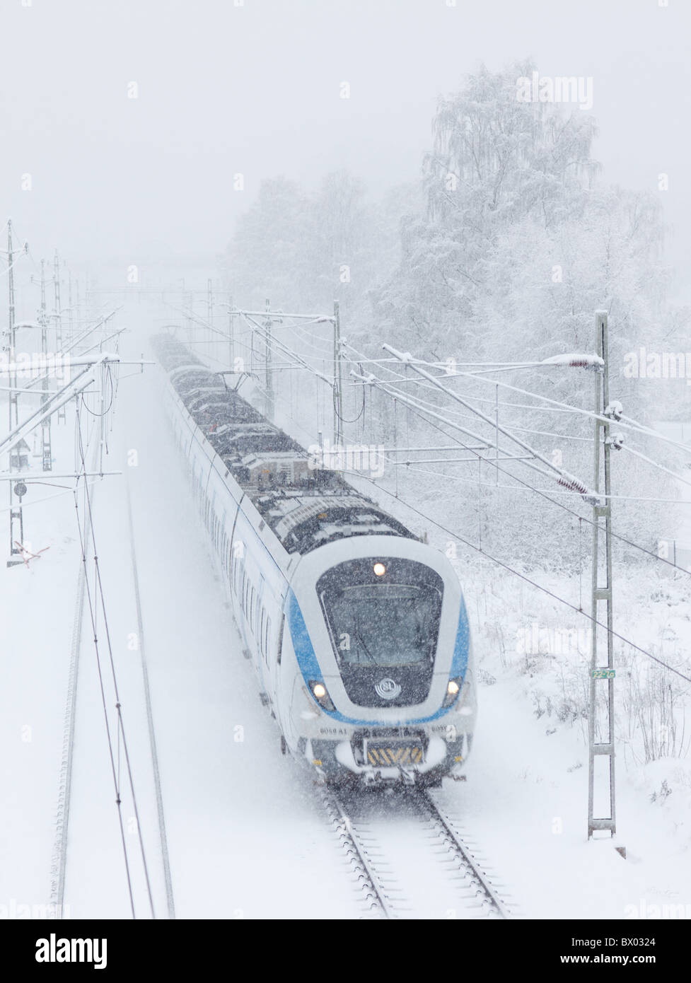 Train passing through winter landscape Stock Photo - Alamy