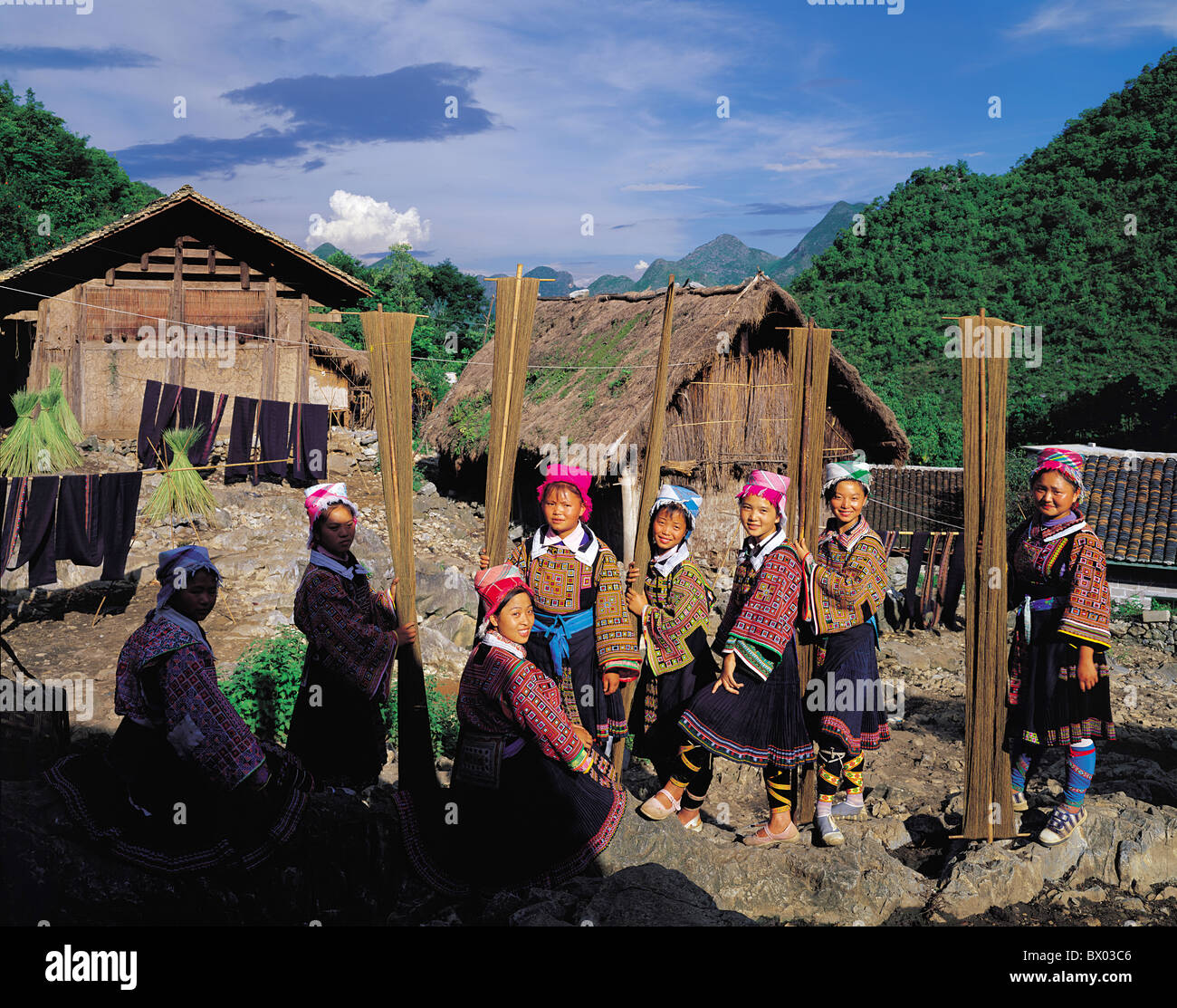 Su Miao women in traditional costume with yarn rack, Dawan Village ...