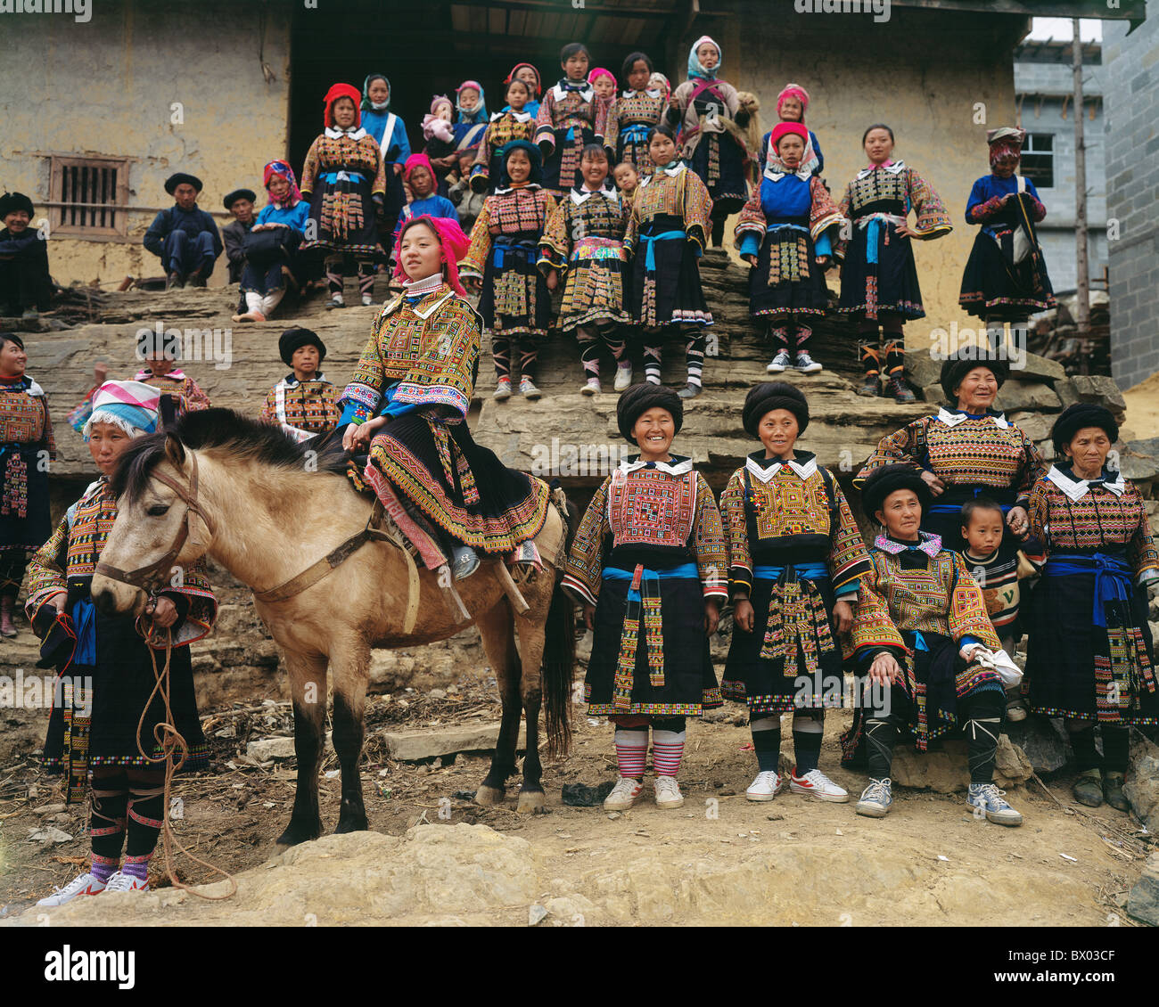 Su Miao bride riding horse during traditional wedding ceremony, Lexiang ...
