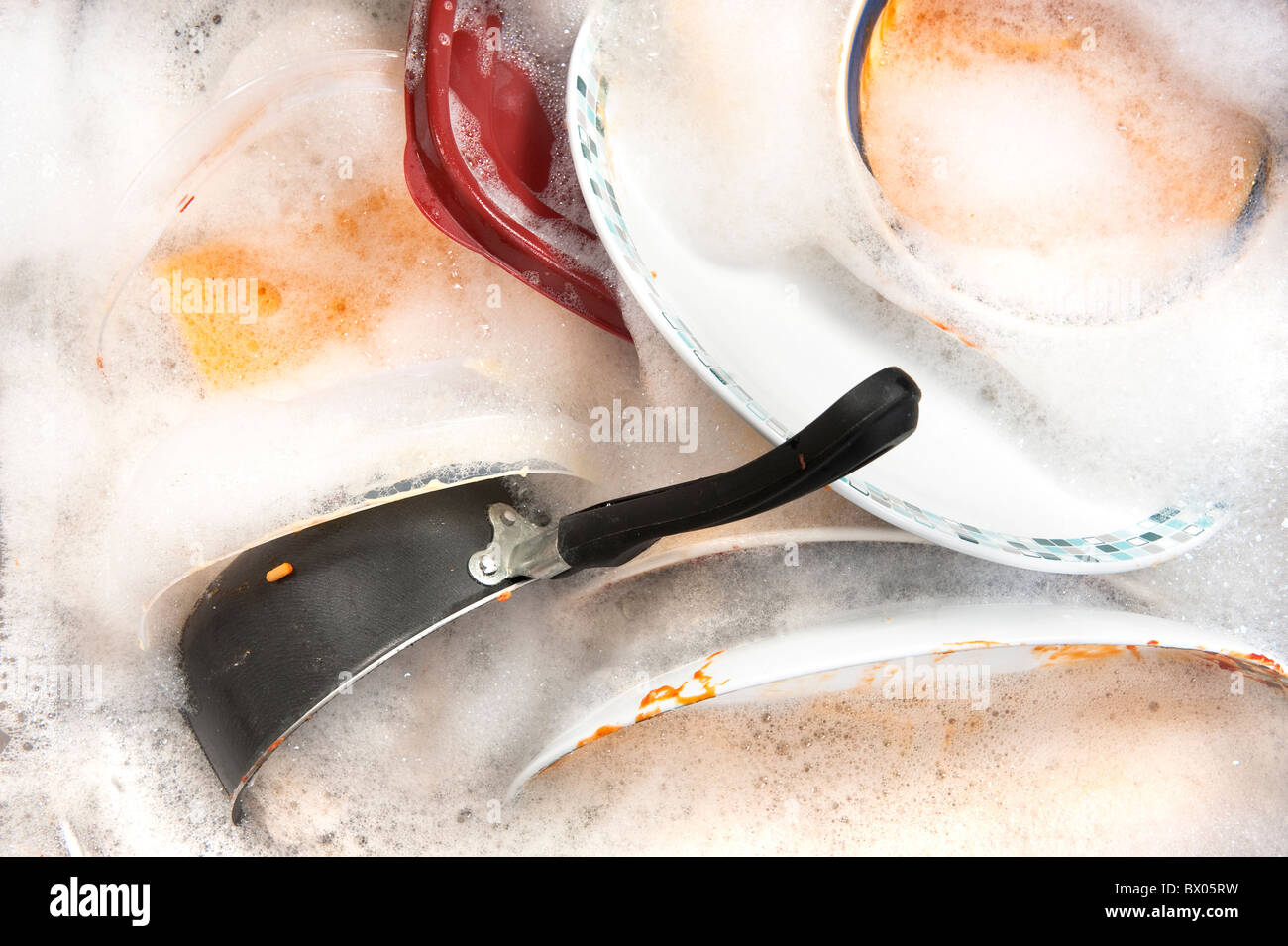 A sink full of dirty dishes and soapy water Stock Photo - Alamy