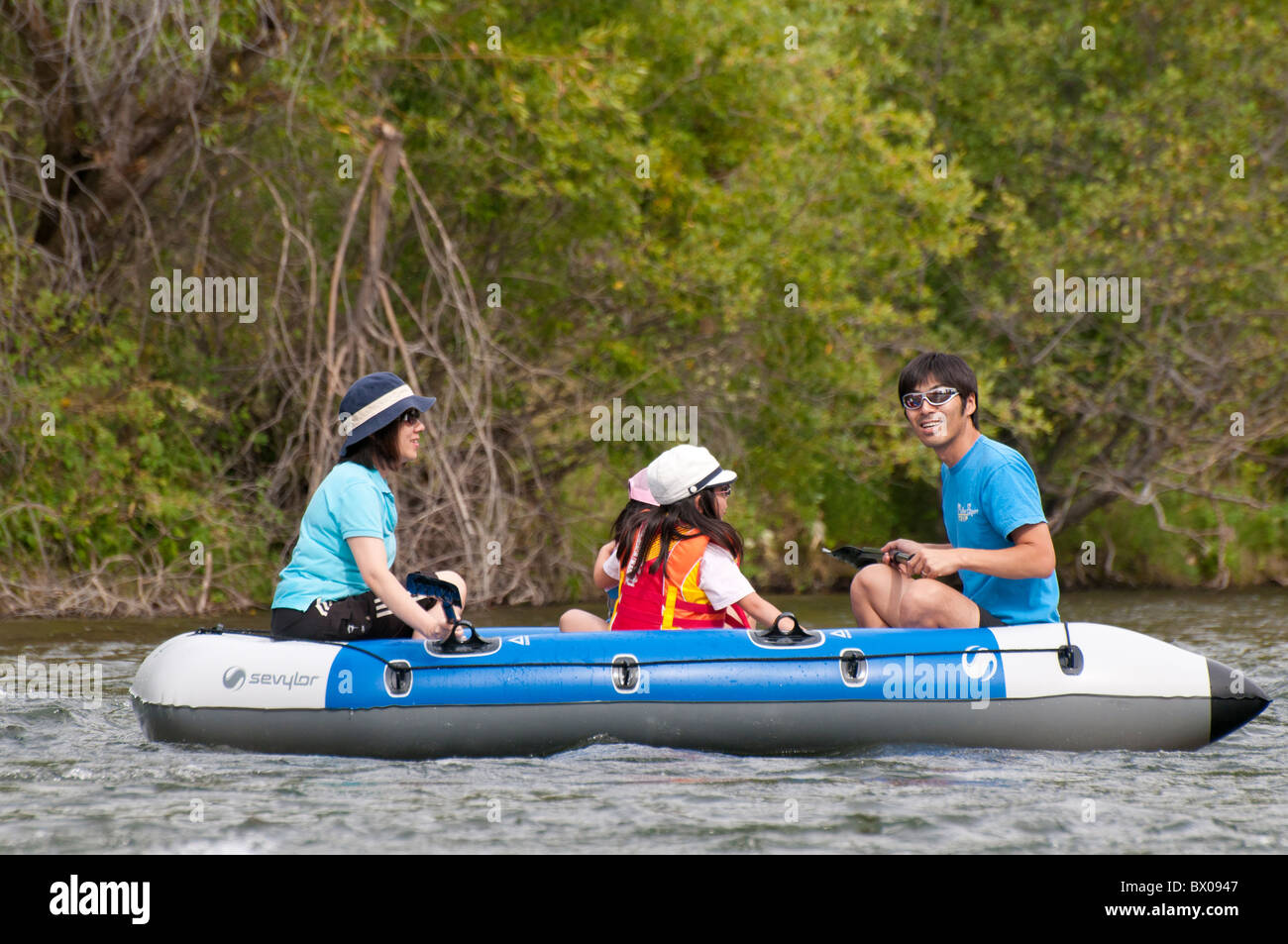 People floating/rafting the Boise river that runs through Downtown ...