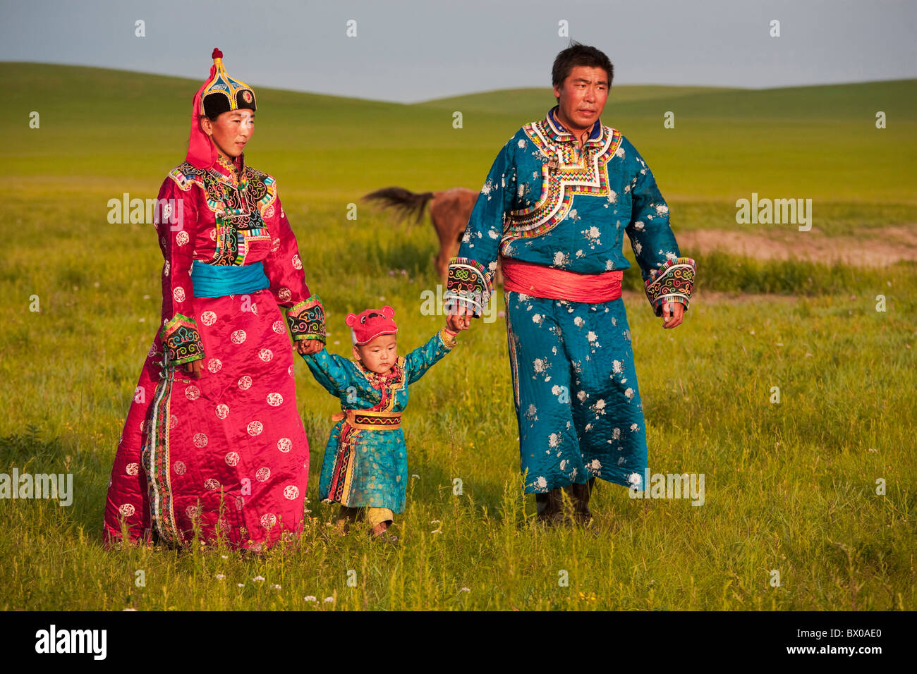 Mongolian couple with child, Xilin Gol Grassland, Xilinhot, Inner ...