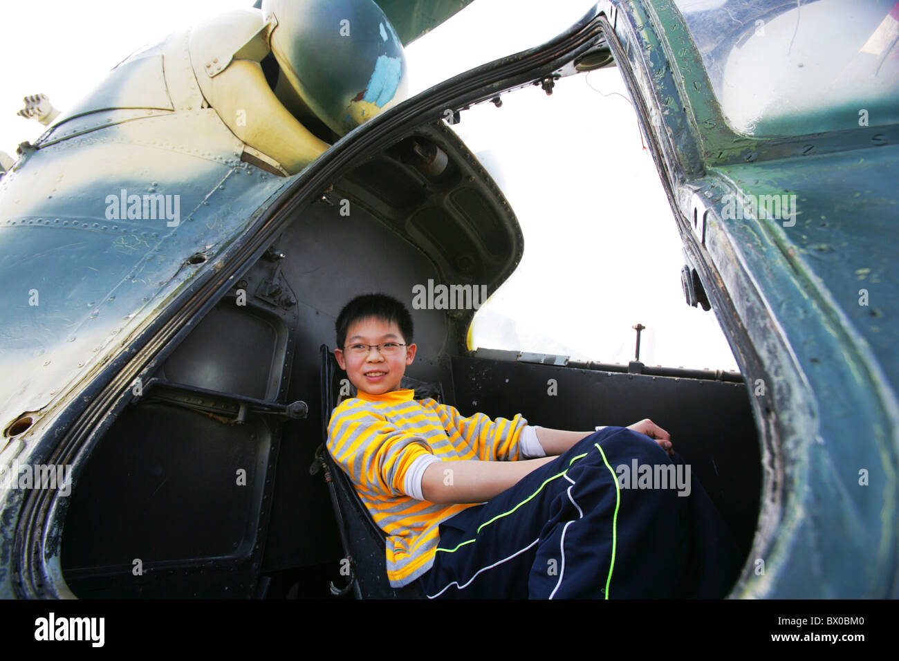 Chinese boy sitting in a fighter jet, Citic Minsk World, Shenzhen ...