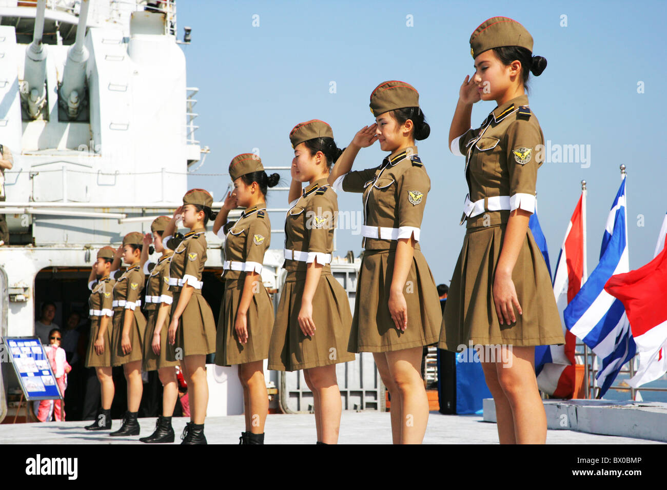 Theme park attendants welcoming tourists, Citic Minsk World, Shenzhen ...
