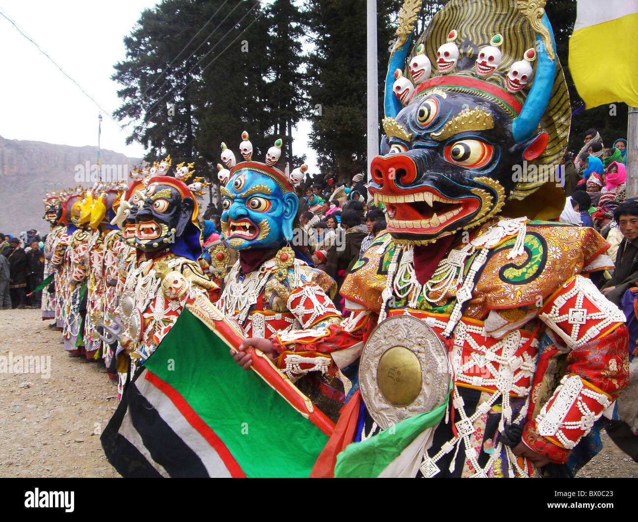 Lamas in elaborate ceremonial robe and mask during religious ritual ...