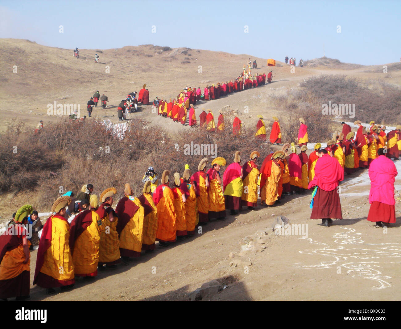 Tibetan lama in ceremonial robe during religious ritual, Langmu ...