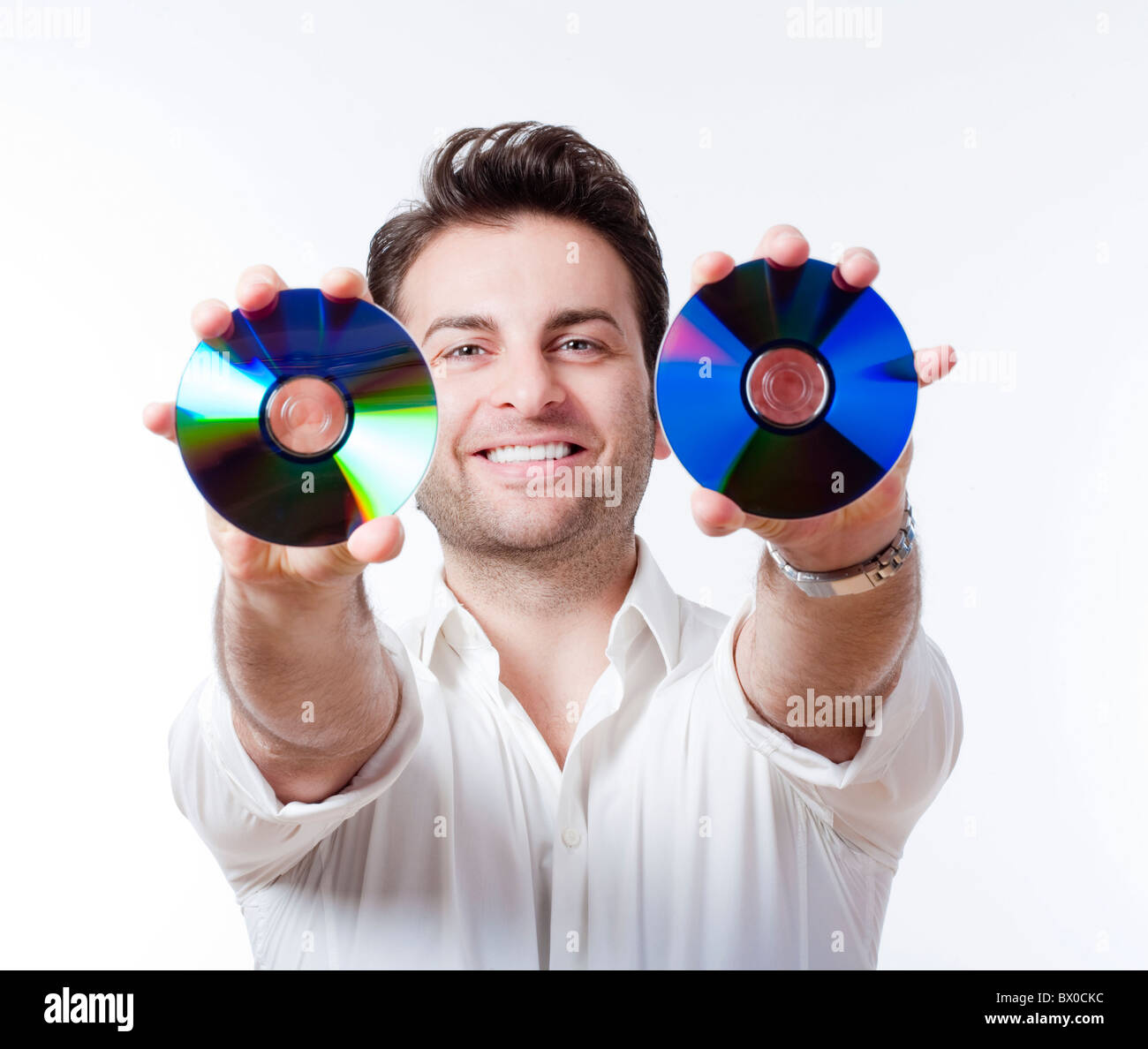 man in shirt standing smiling holding CDs - isolated on white Stock ...