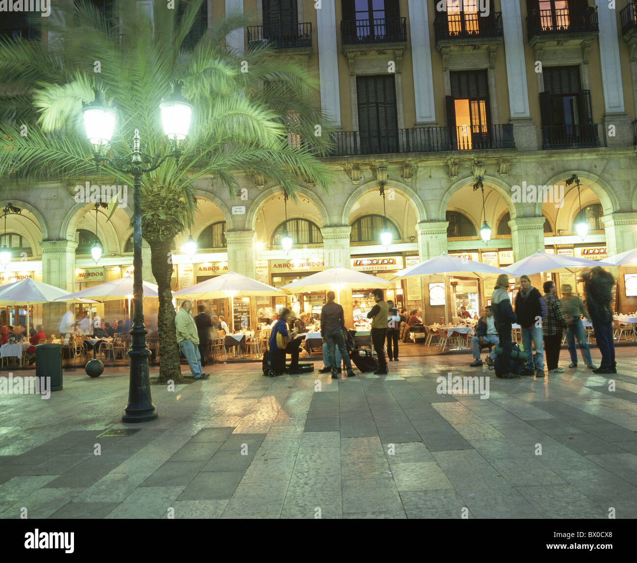 arcades Barcelona life people at night Placa Reial Spain Europe street ...