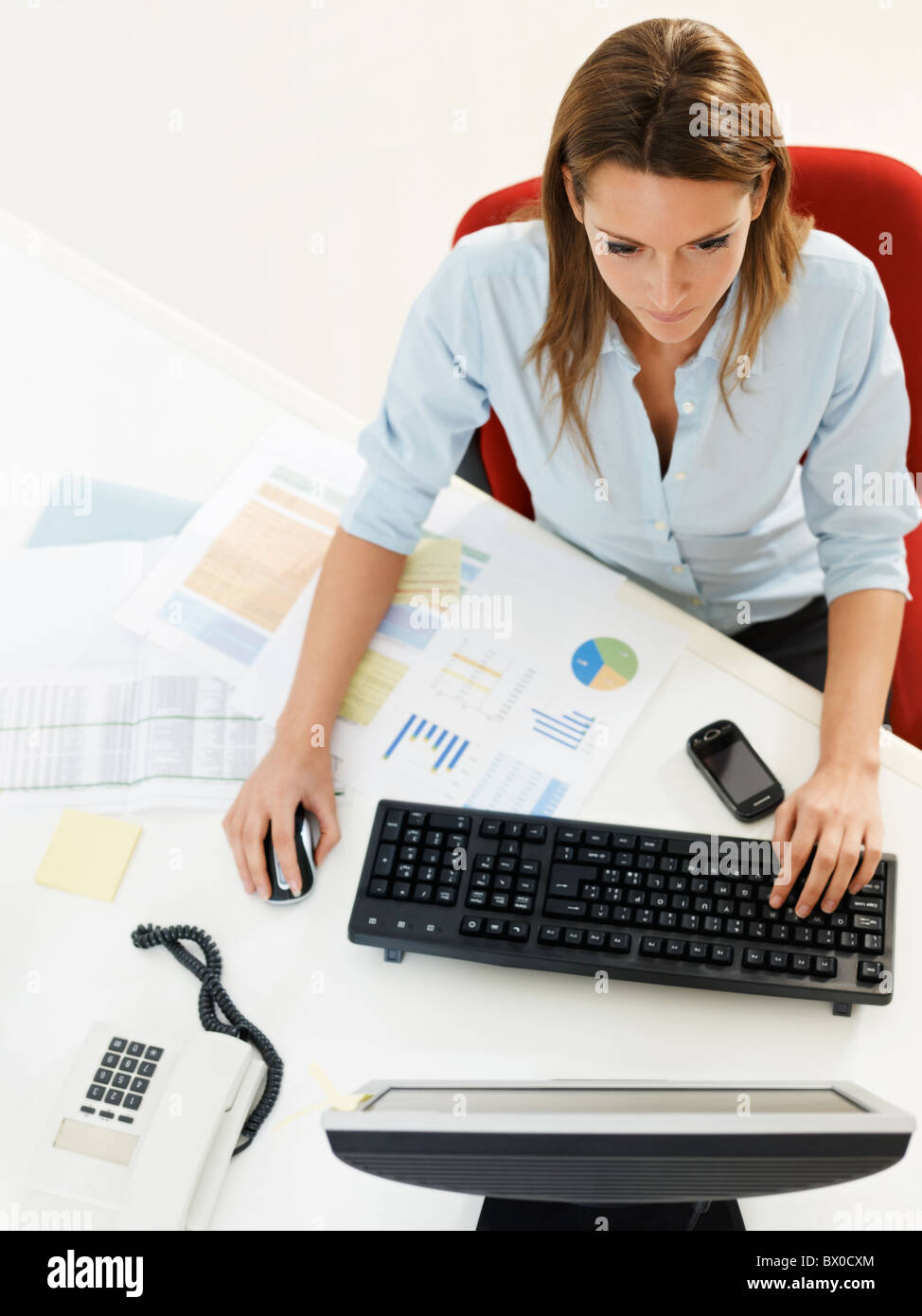woman working on computer in office Stock Photo - Alamy