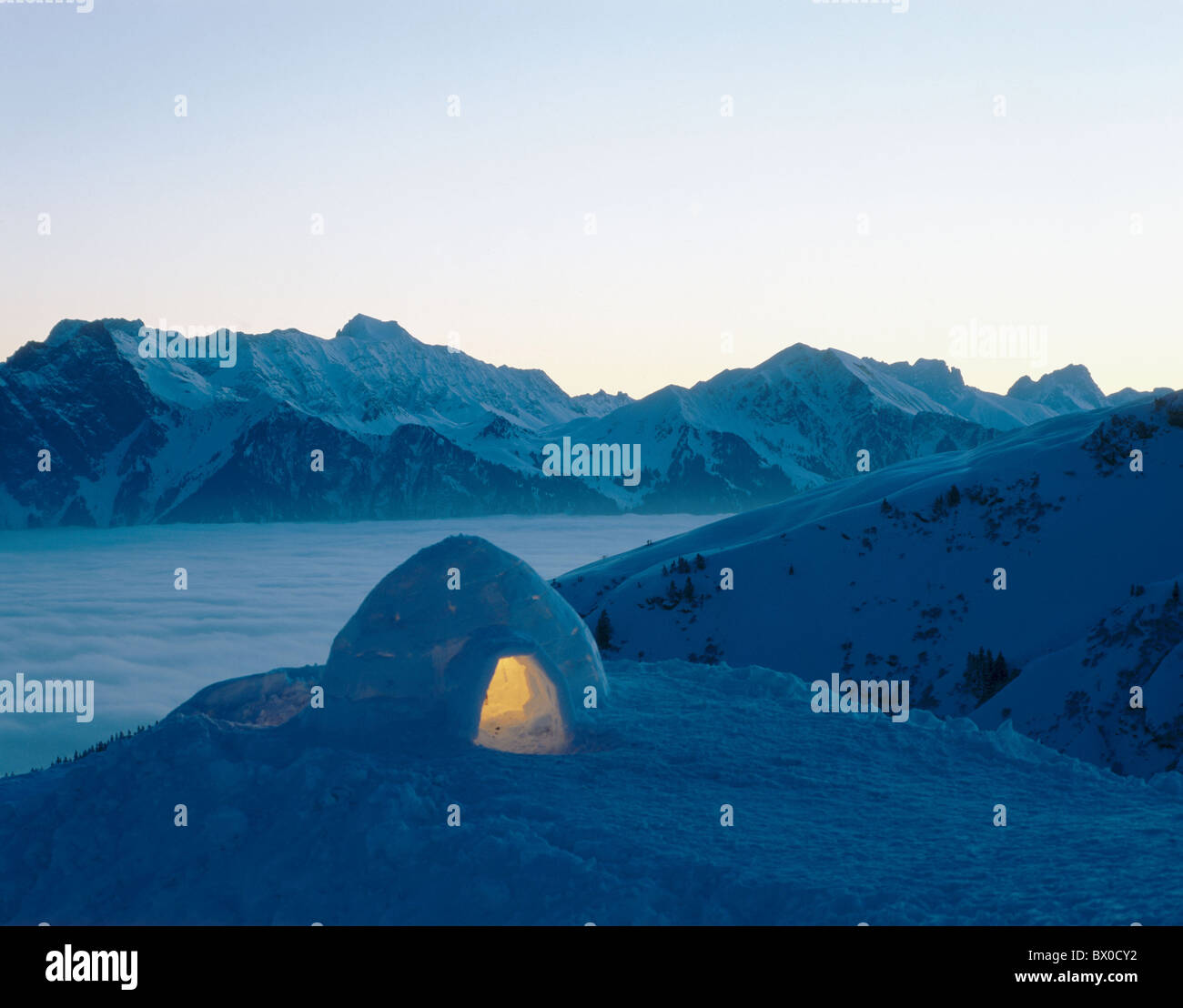 dusk twilight illuminates Graubunden Grisons igloo sea of fog Pizol ...