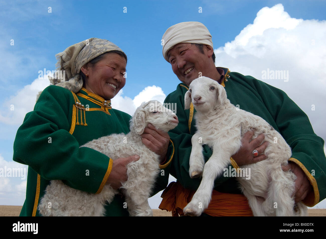 Barag Mongolian couple in traditional costume with lamb, Old Barag ...