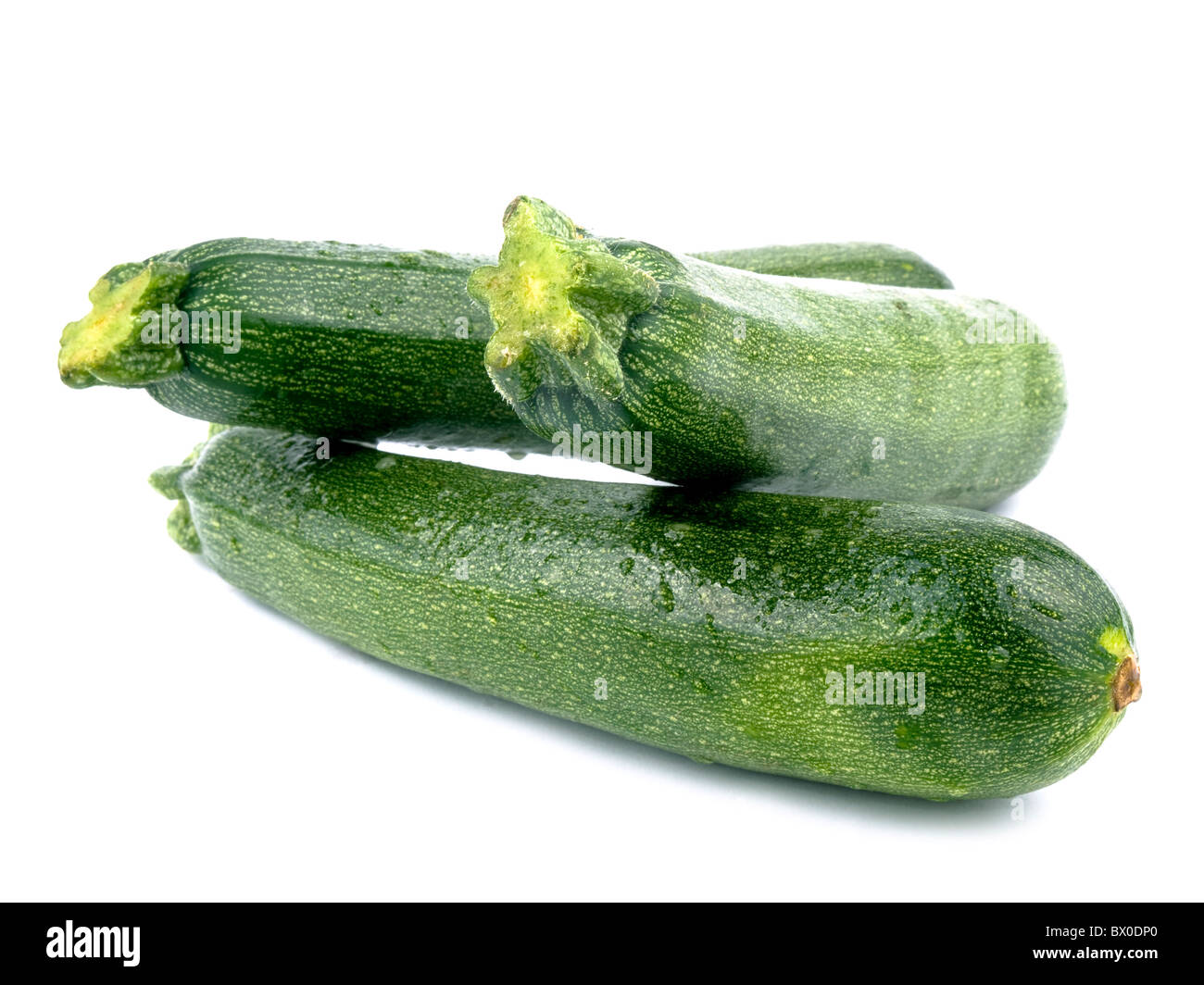 Fresh green zucchini on white background Stock Photo - Alamy