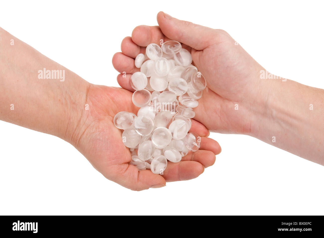 Pellucid stones in hands on white background- tender relationships ...