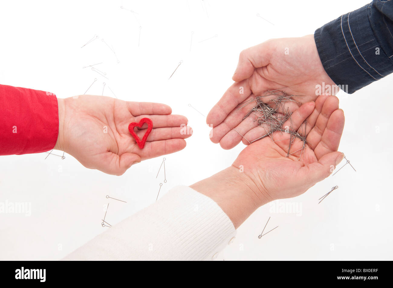 Three hands on white background symbolising complicated relationships ...