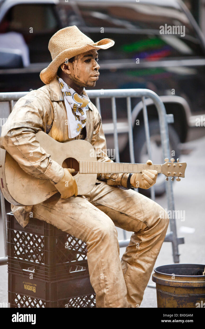 Men painted in gold/silver perform for tips on Bourbon Street in New ...