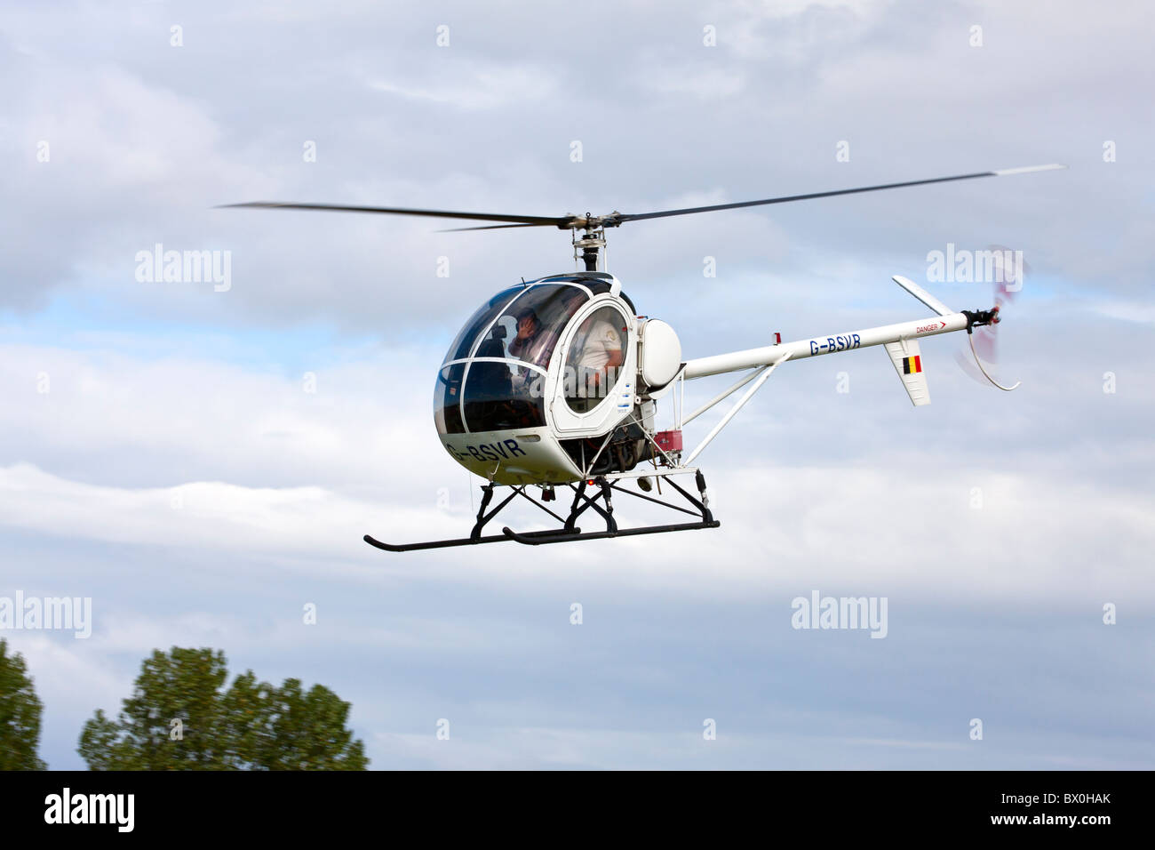 Schweizer 269C 300 G-BSVR on final approach to land at Breighton ...