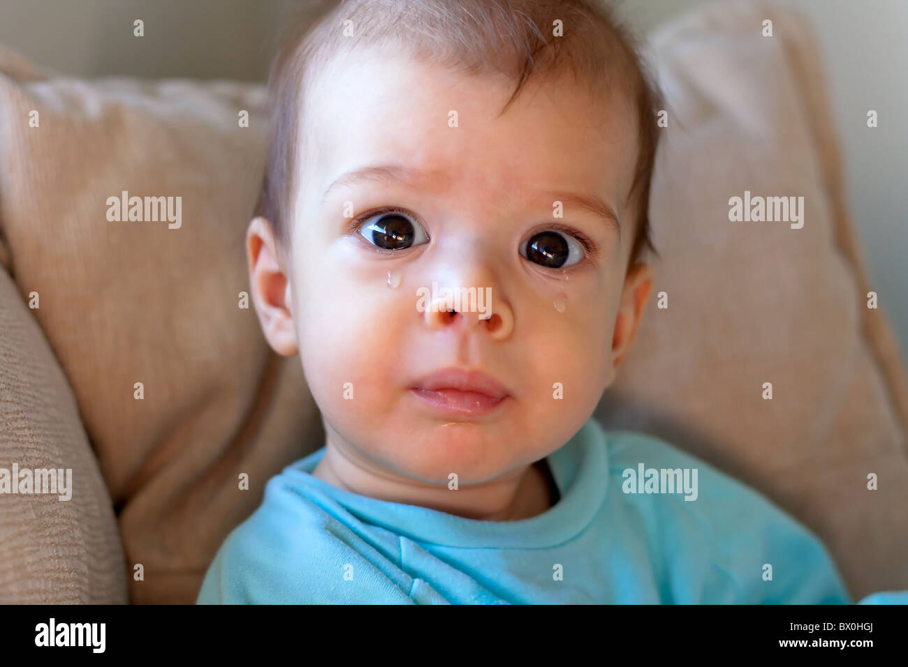 Cute young boy is crying. Tears on cheeks Stock Photo - Alamy