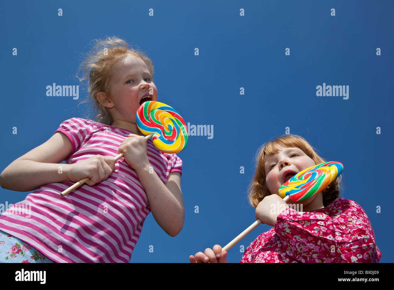 Girls with giant lollipop, London, UK Stock Photo - Alamy