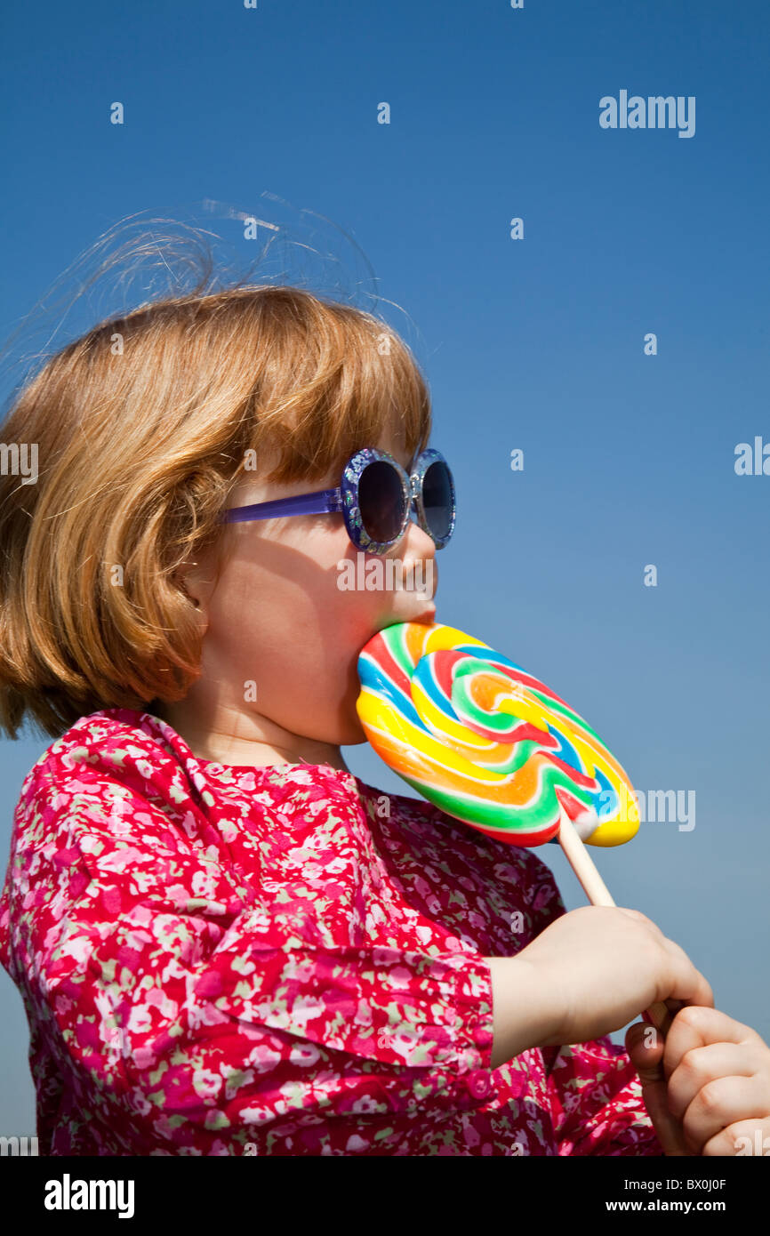 Girl with giant lollipop, London, UK Stock Photo - Alamy