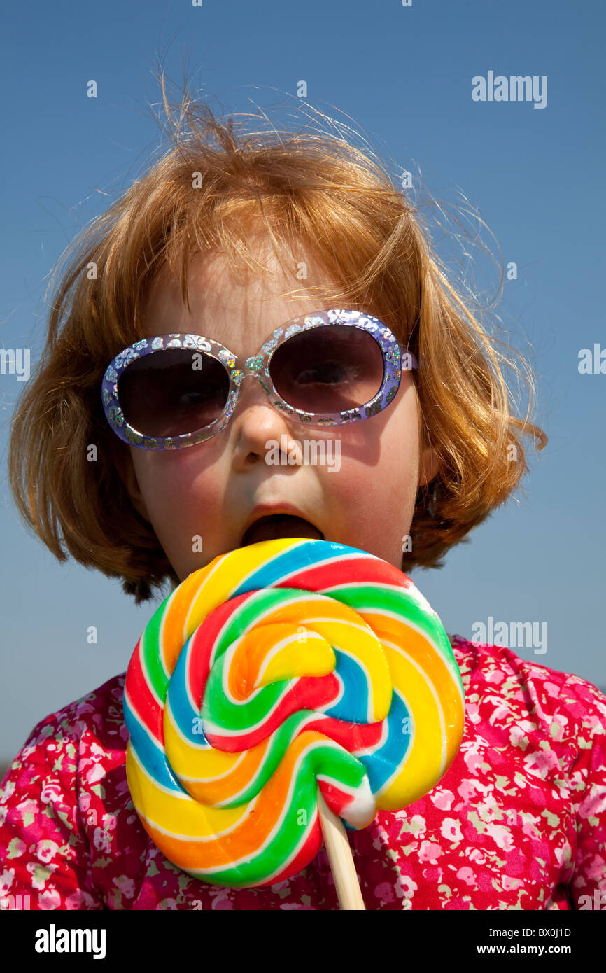 Girl with giant lollipop, London, UK Stock Photo - Alamy