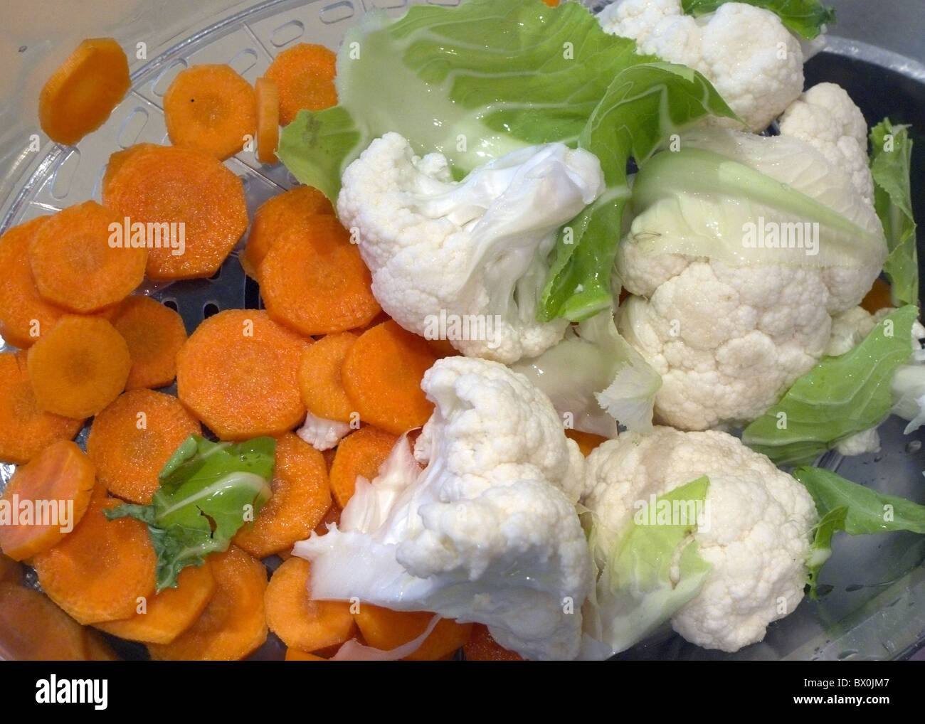 Washed Raw Mixed vegetables in a Bowl comprising of Chopped Carrots and ...