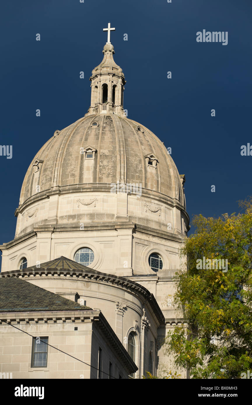 Catholic cathedral dome in last light of day with dark of night coming ...