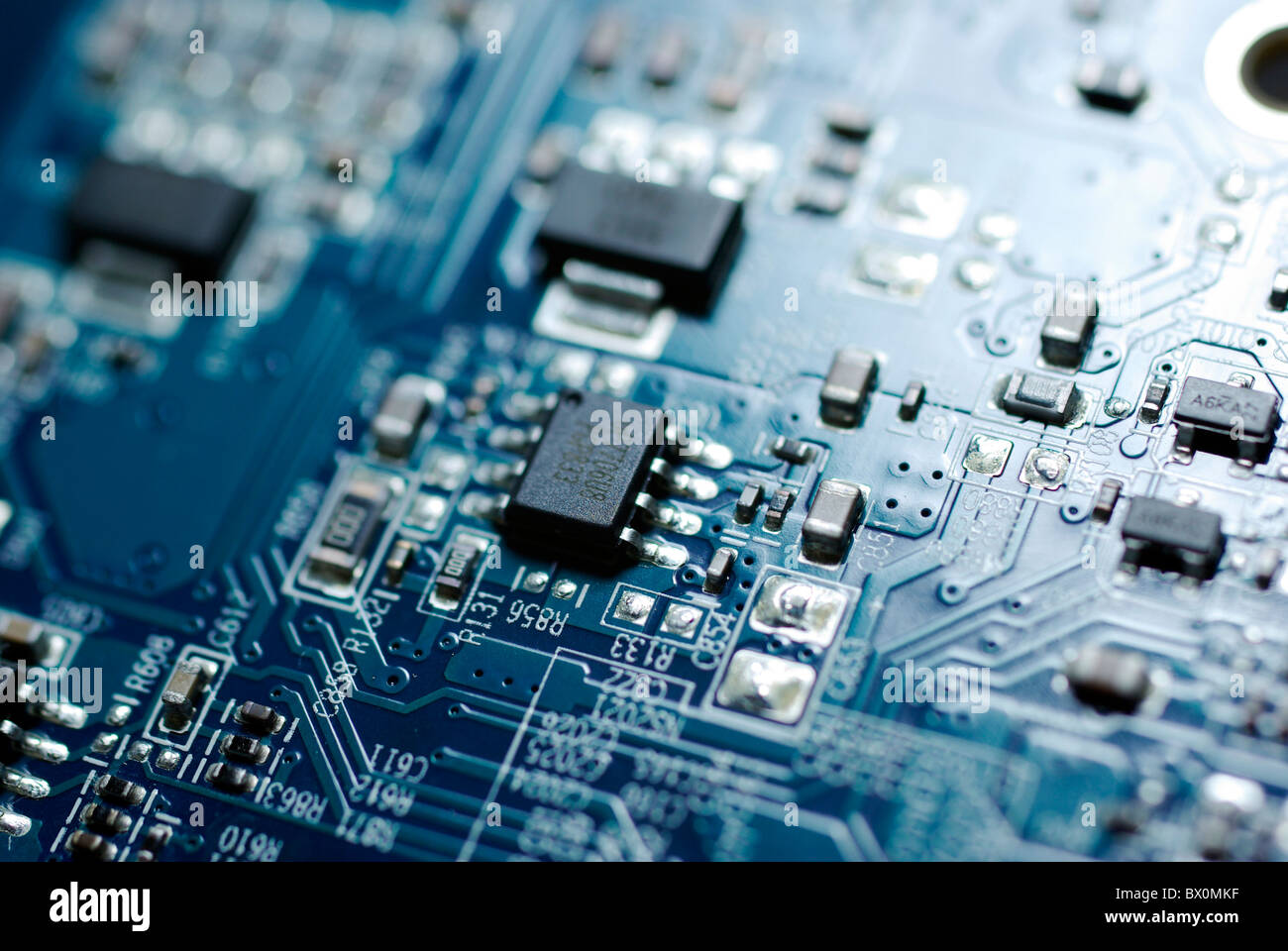 Blue electronic computer circuit board hardware. Integrated motherboard ...