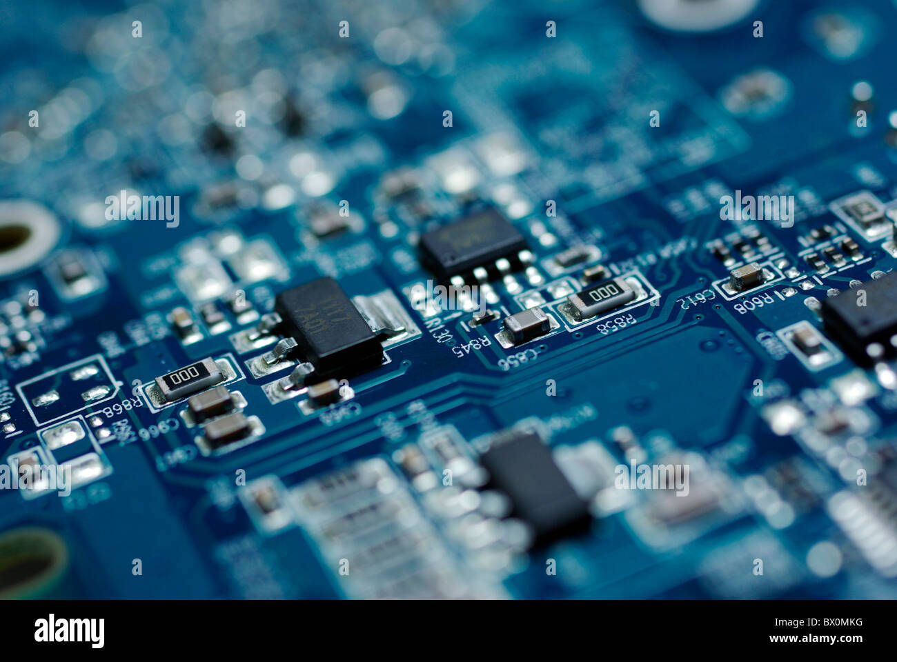 Blue electronic computer circuit board hardware. Integrated motherboard ...