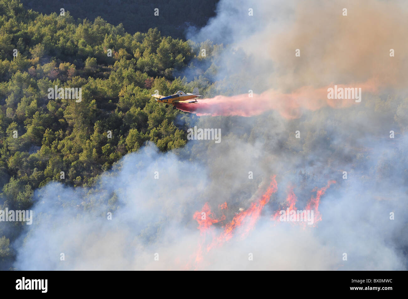 Fire retardant is dropped from planes as a huge forest fire rages on ...