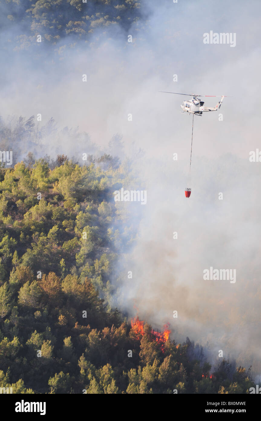Fire retardant is dropped from planes as a huge forest fire rages on ...