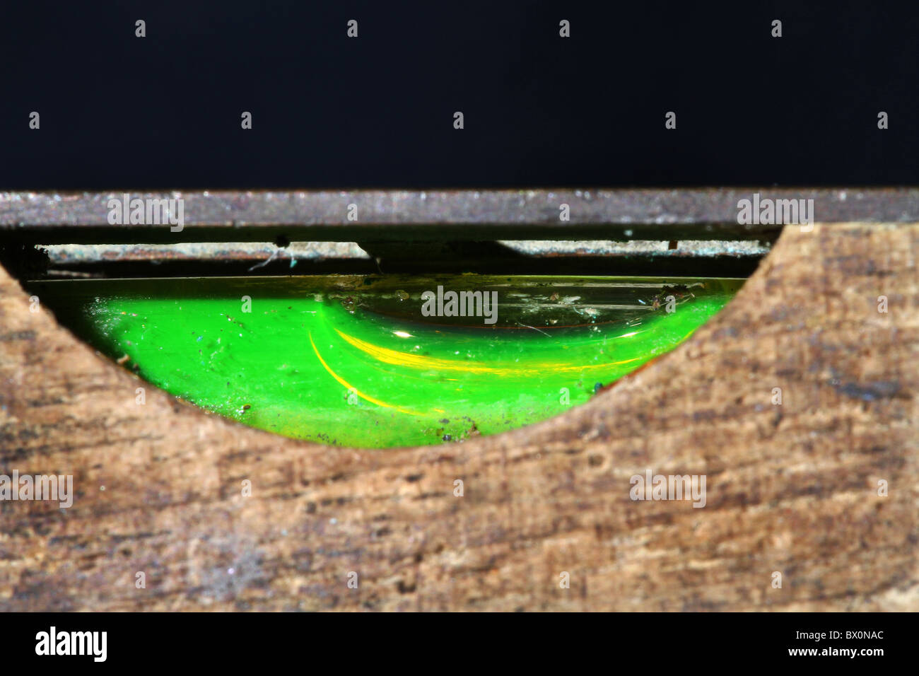 Detail of liquid flourescent spirit level bubble Stock Photo - Alamy