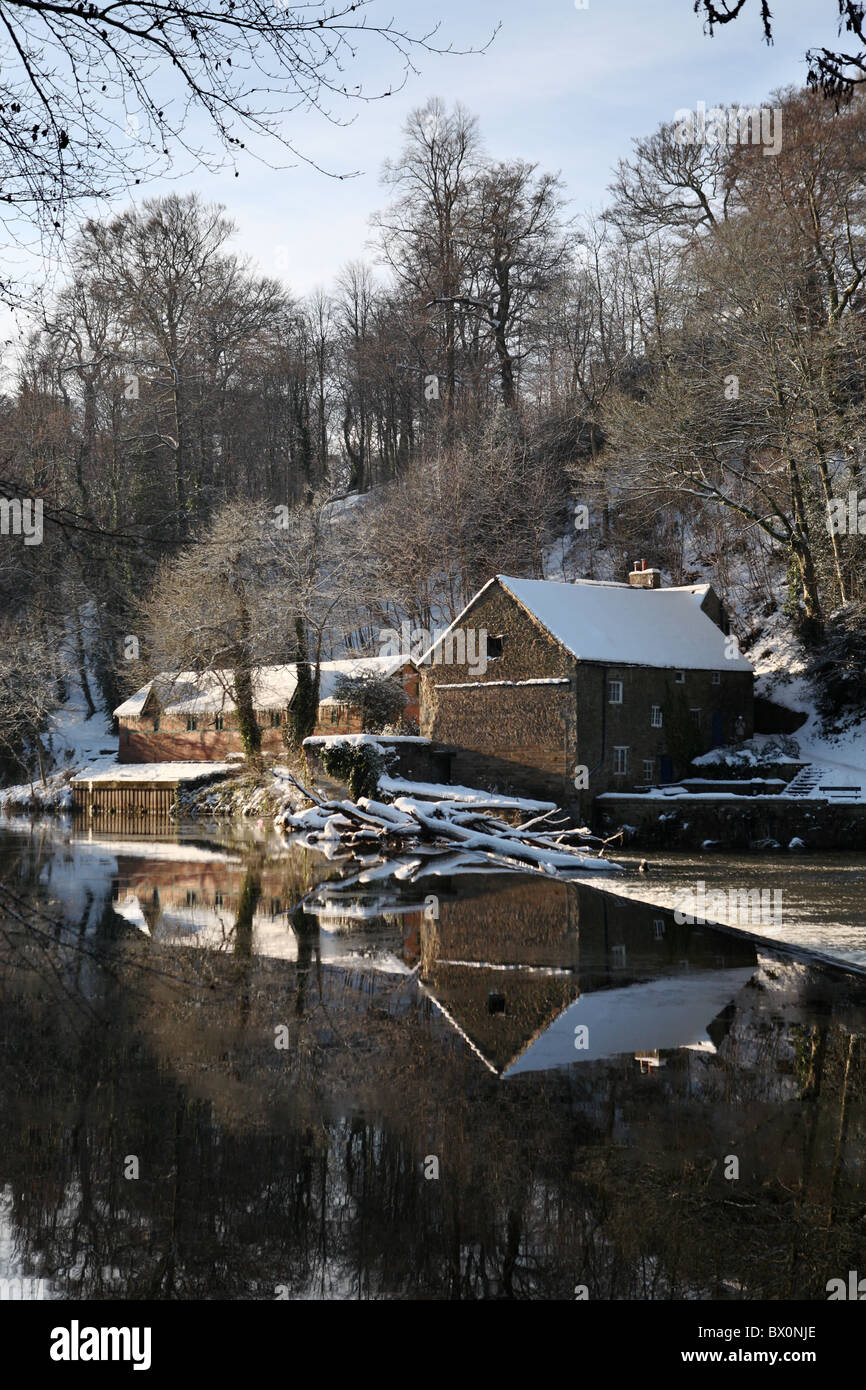 The mill house and weir seen reflected in the river Wear, Durham City ...