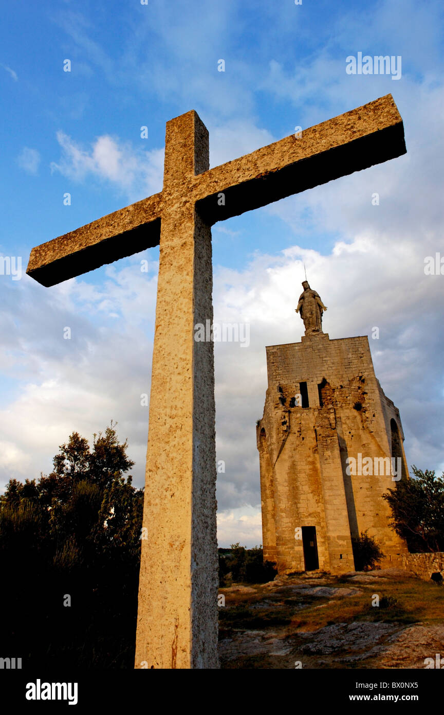 Stone crucifix outside a church in Clansayes Village at dusk, Drome ...