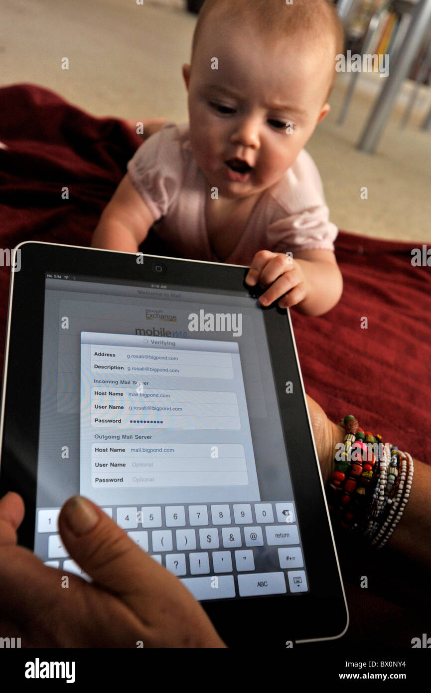 Baby with Ipad Stock Photo - Alamy