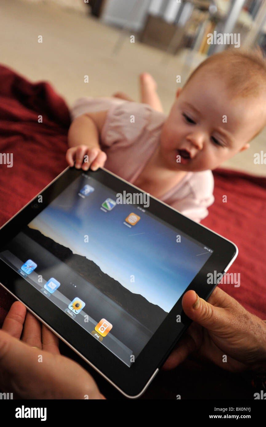 Baby with Ipad Stock Photo - Alamy
