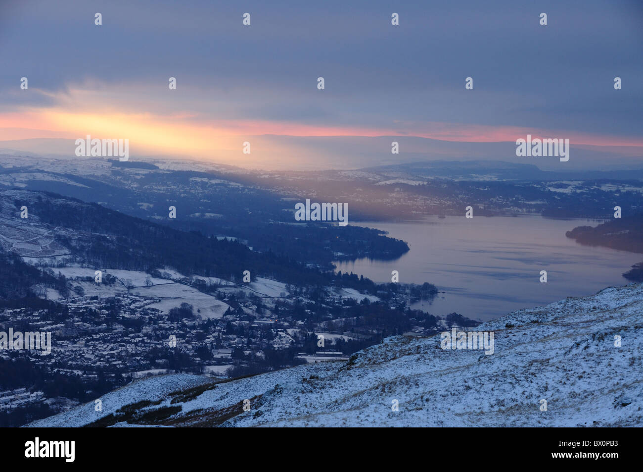 Ray of sunlight over Lake Windermere in winter in the English Lake ...